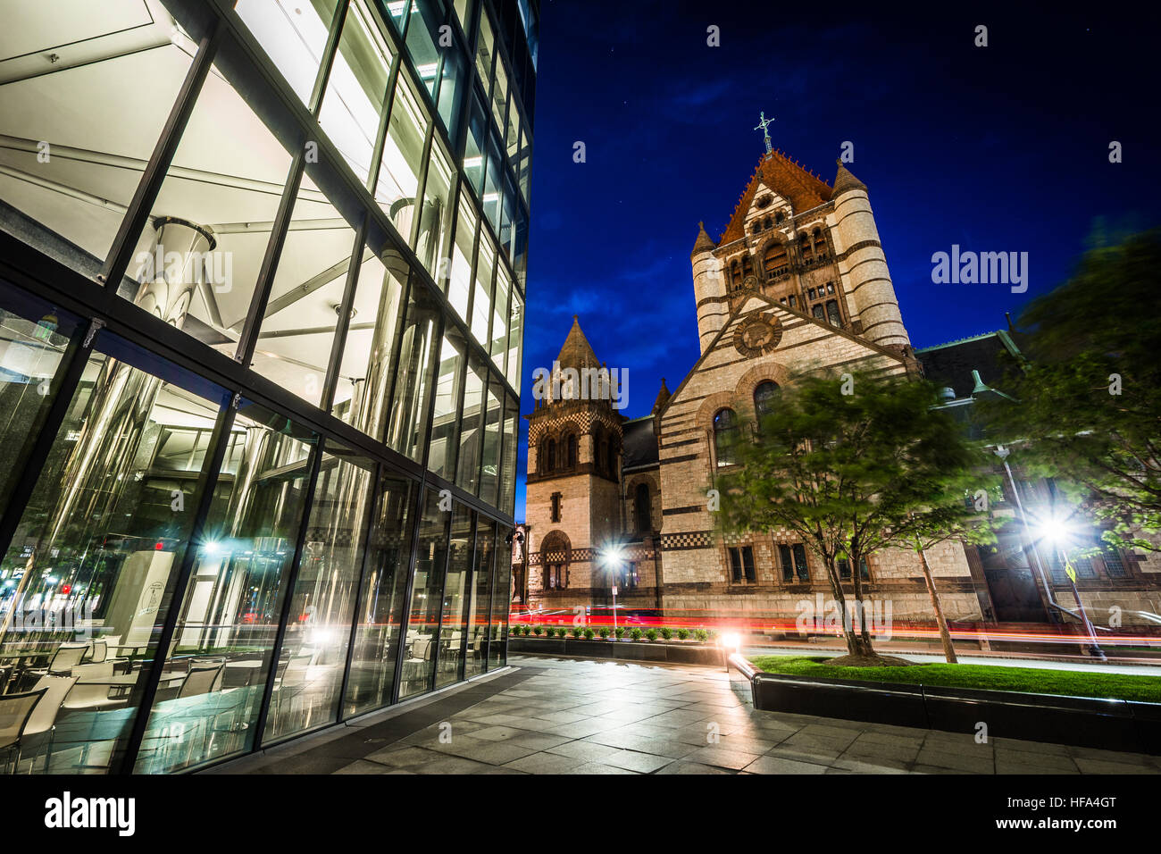 Trinity Church and a modern building at Copley at night, in Back Bay ...