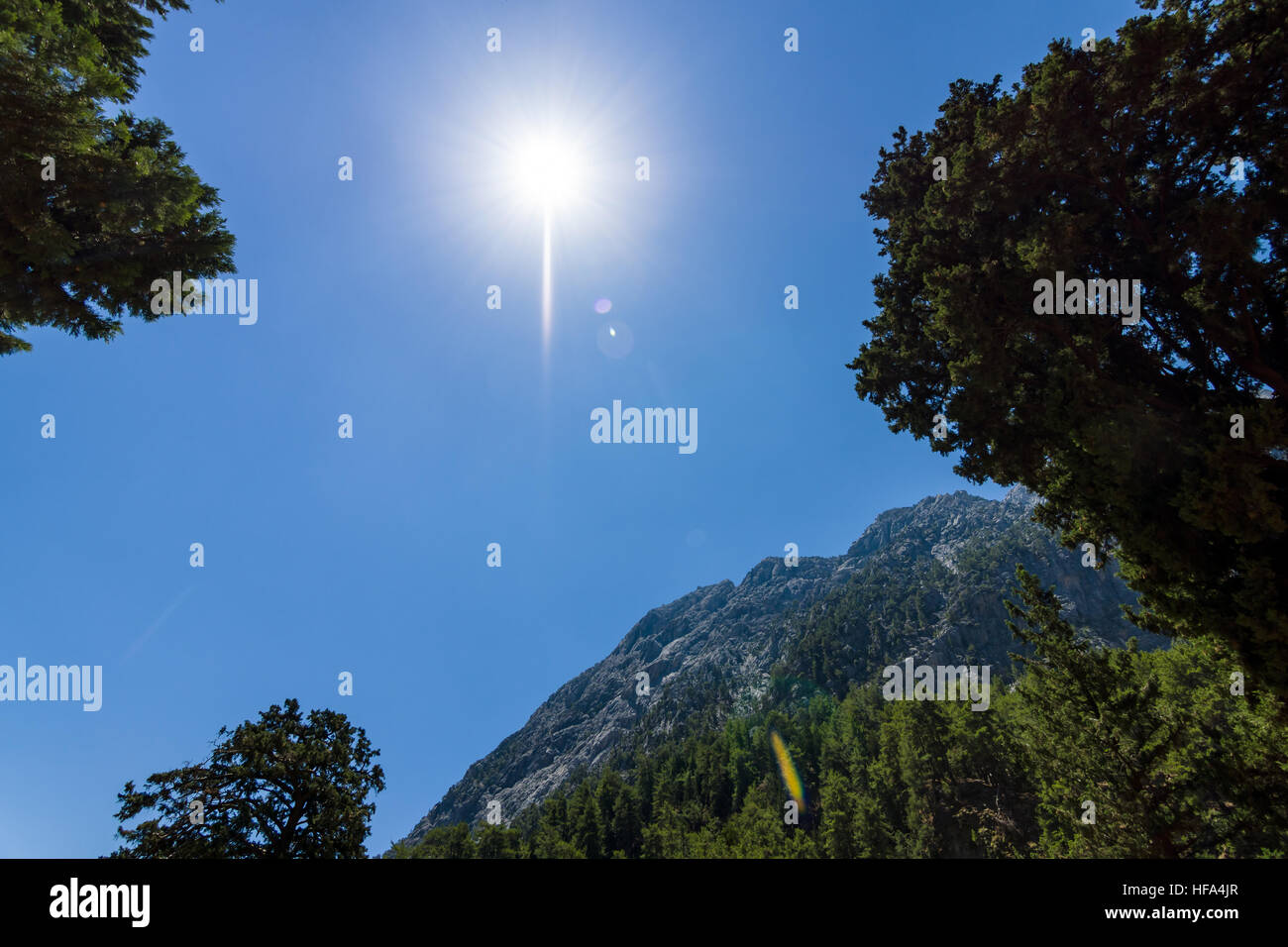 Samaria Gorge. Crete. Greece. Lens flare on the blue sky Stock Photo ...