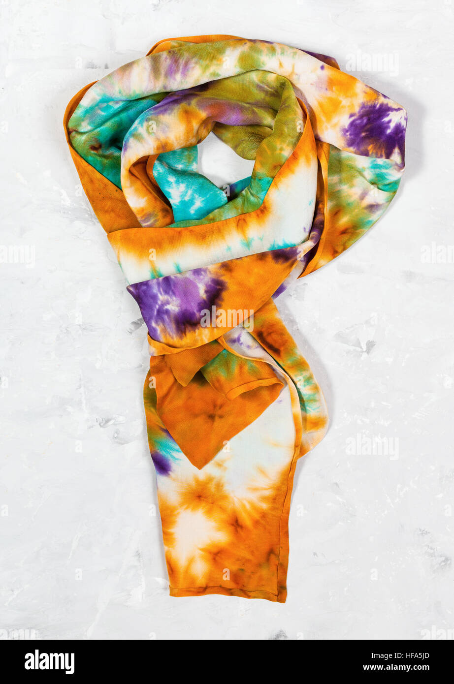 tied hand painted silk scarf on concrete plate Stock Photo - Alamy