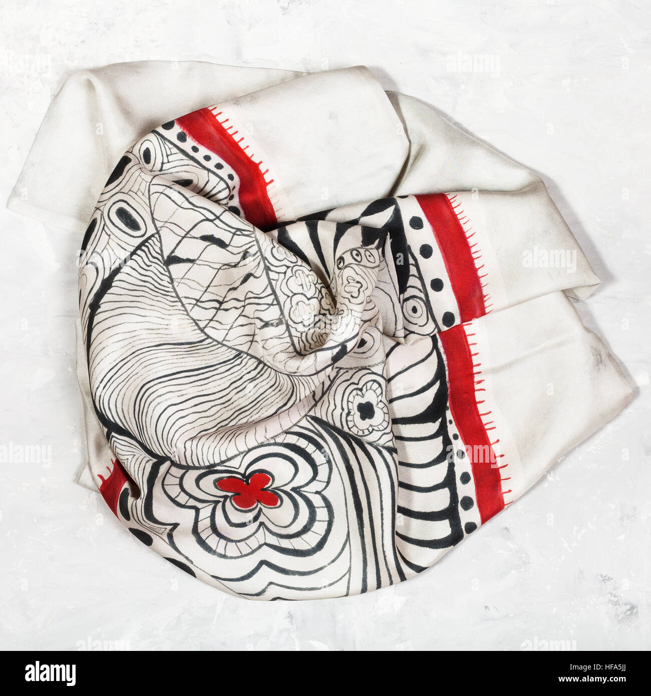 hand painted silk head scarf on concrete plate Stock Photo - Alamy