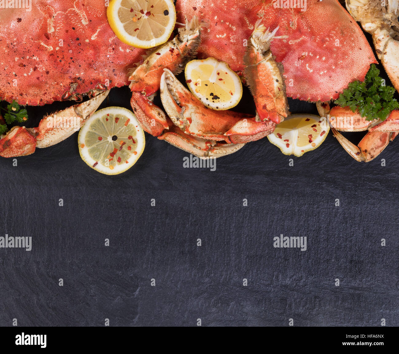 Overhead view of cooked crab on upper border of natural slate Stock ...