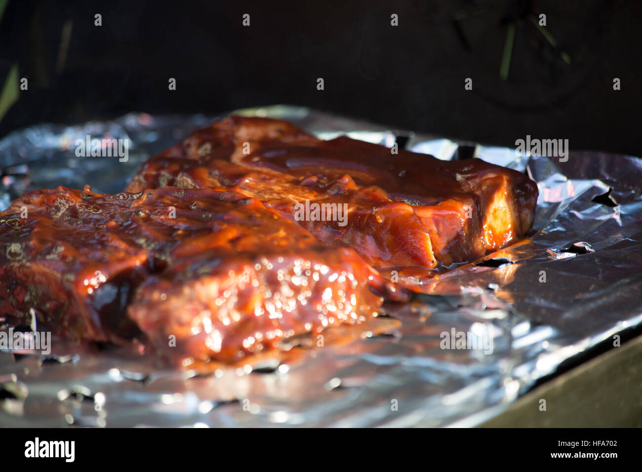 Marinated ribeye steak on a grill Stock Photo - Alamy