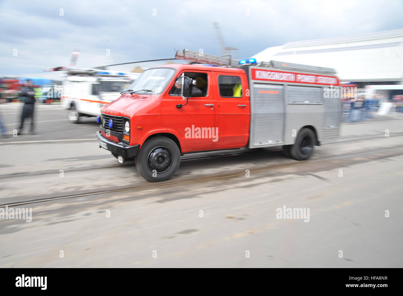 Classic Renault Dodge fire engine driving with its blue lights flashing ...