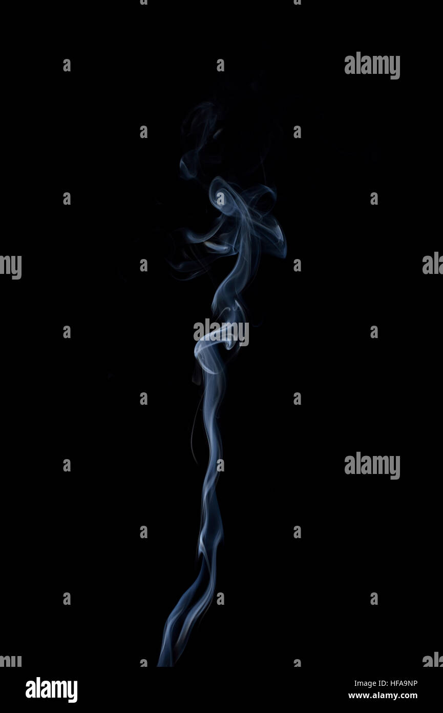 smoke trail on black background Stock Photo - Alamy