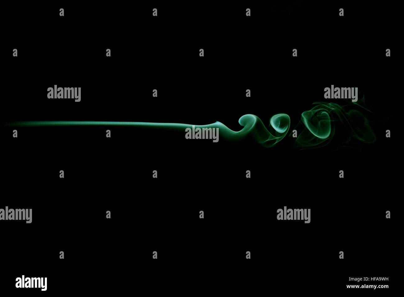 Green smoke wave isolated on black. Green smoke trail isolated on black ...