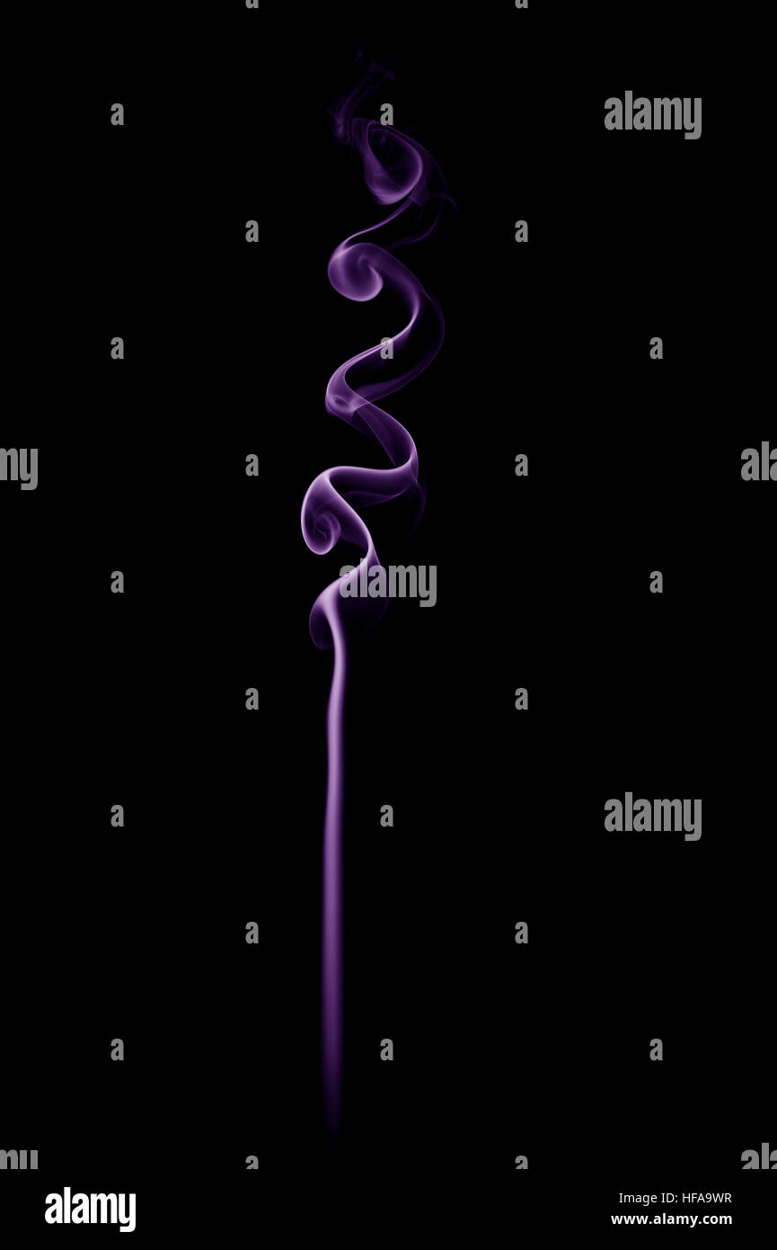 violet smoke trail on black background Stock Photo - Alamy