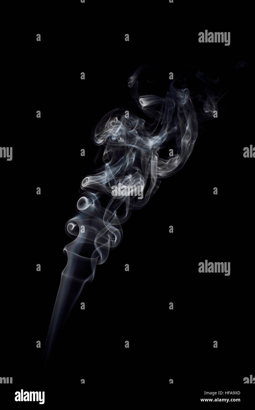 Smoke swirl on black background Stock Photo - Alamy