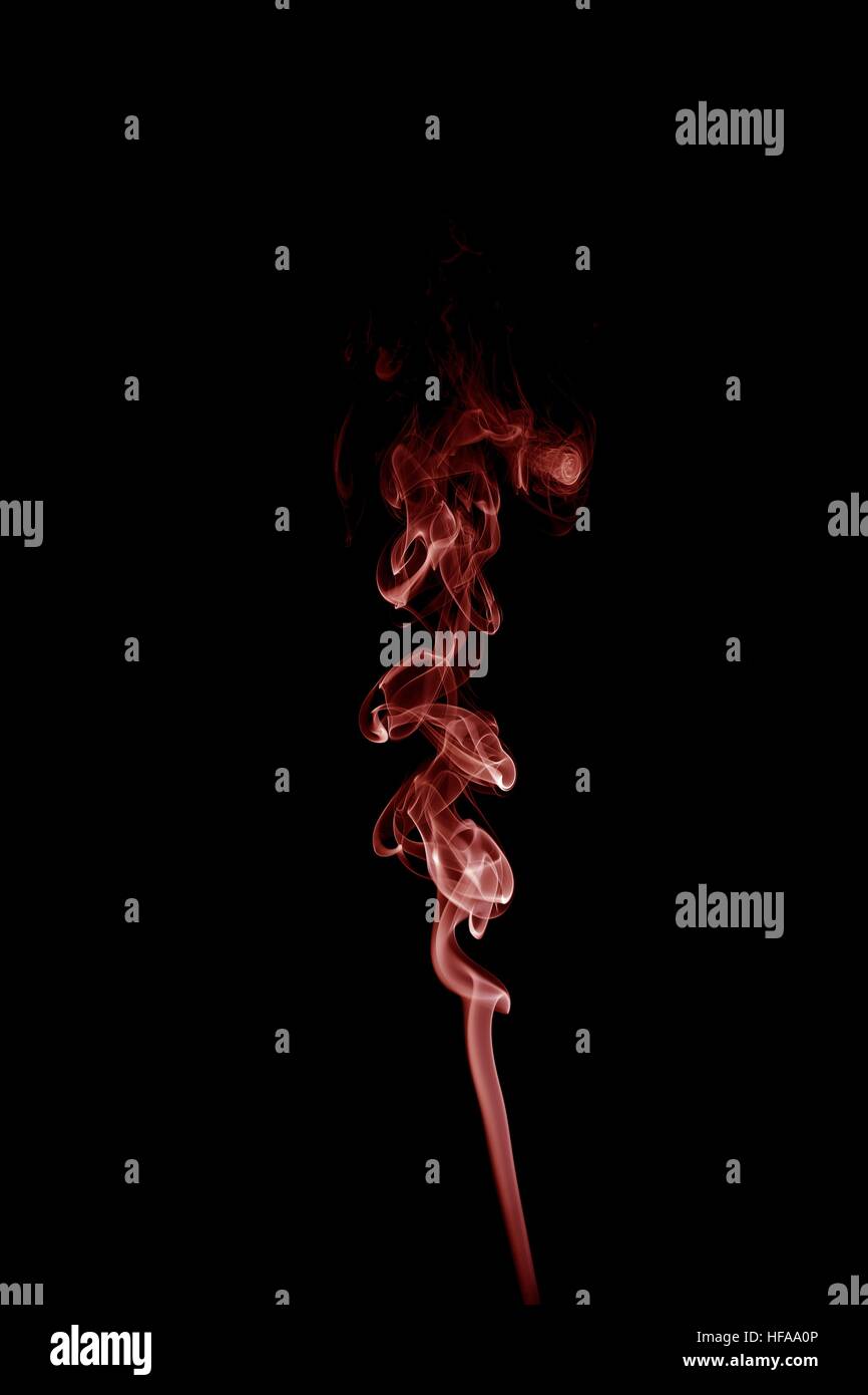 Red smoke isolated on black Stock Photo - Alamy