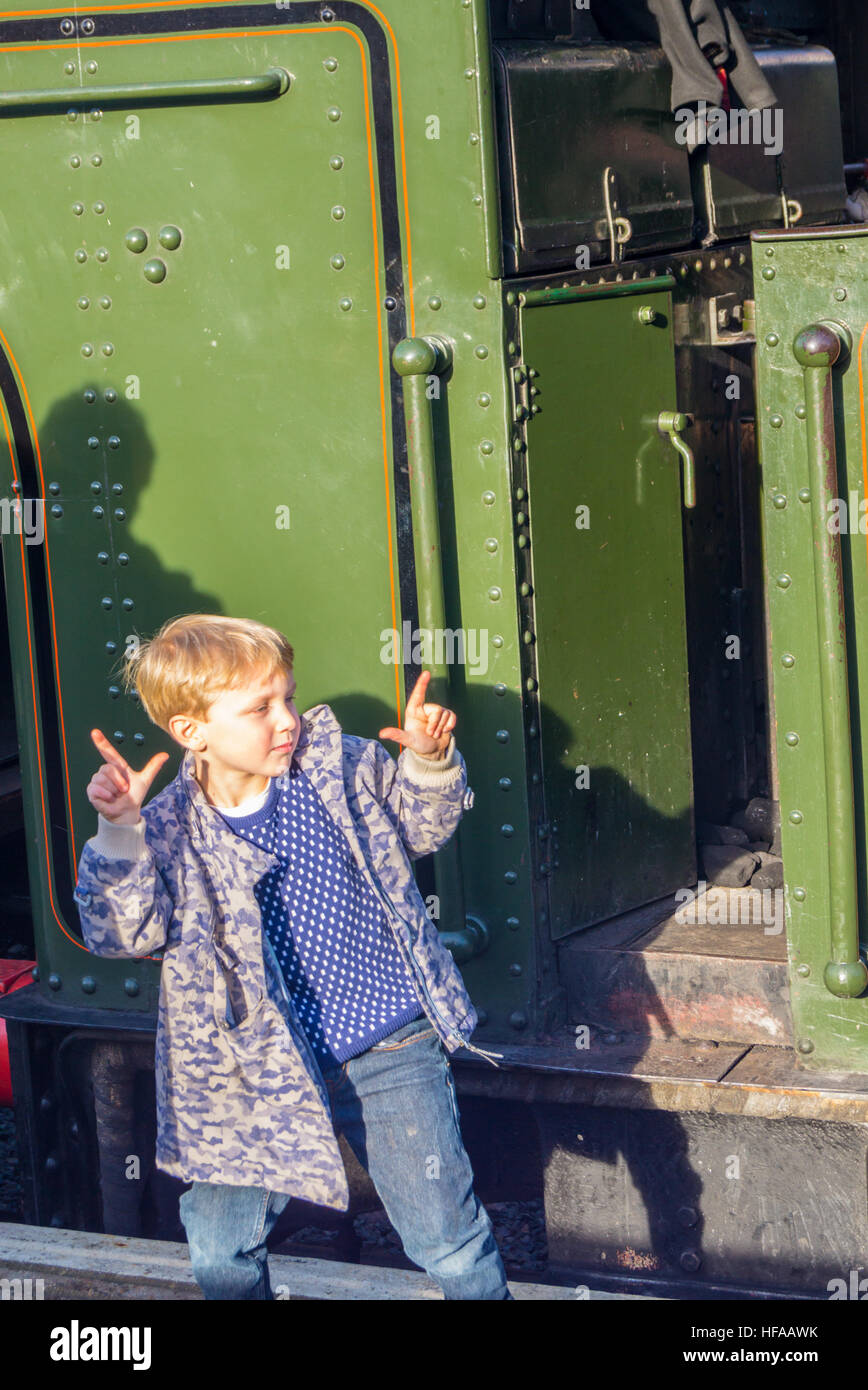 A young boy posing by GWR 6430 pannier tank locomotive, 1932, North ...