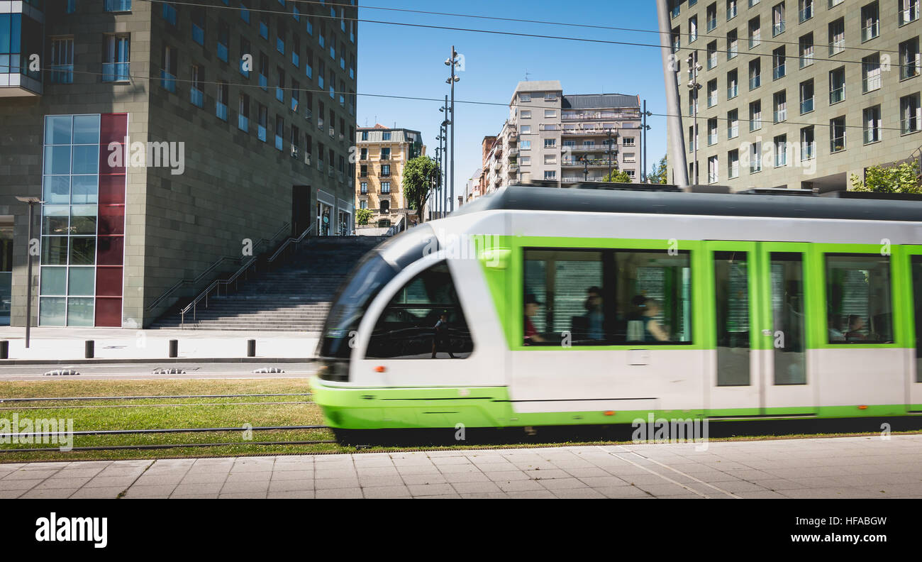 Tram running at full speed in the city of Bilbao, Spain Stock Photo - Alamy