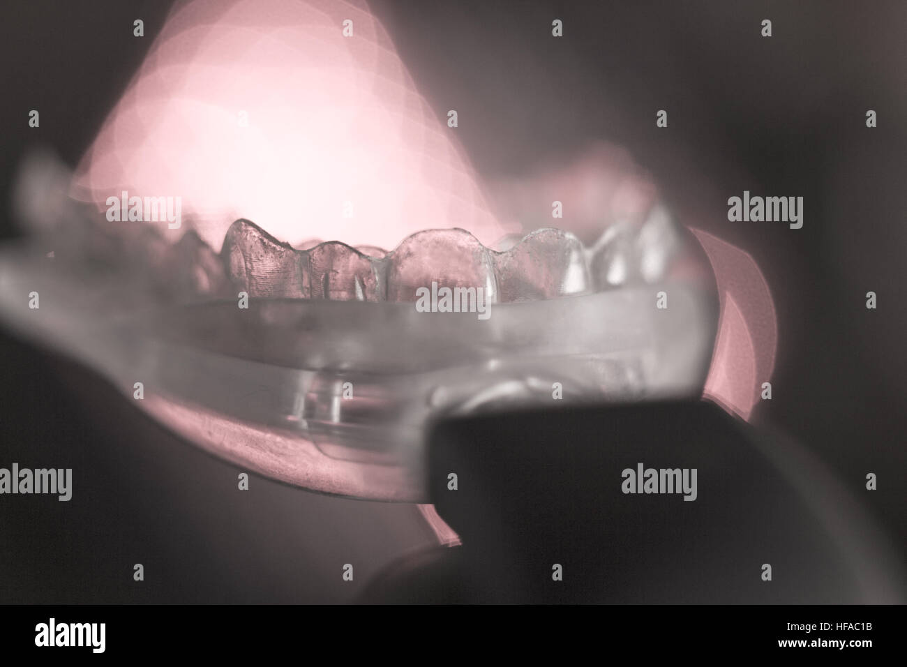 Vibrating dental device with invisible orthodontics Stock Photo - Alamy