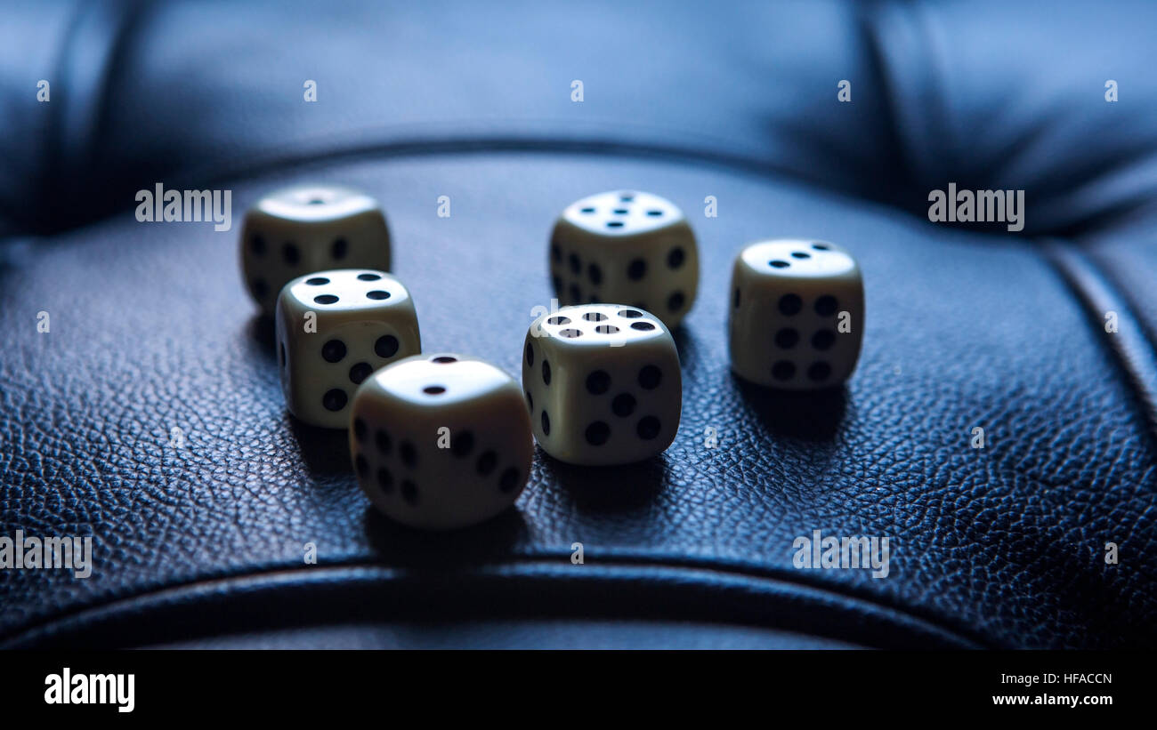 six dice on black leather Stock Photo - Alamy