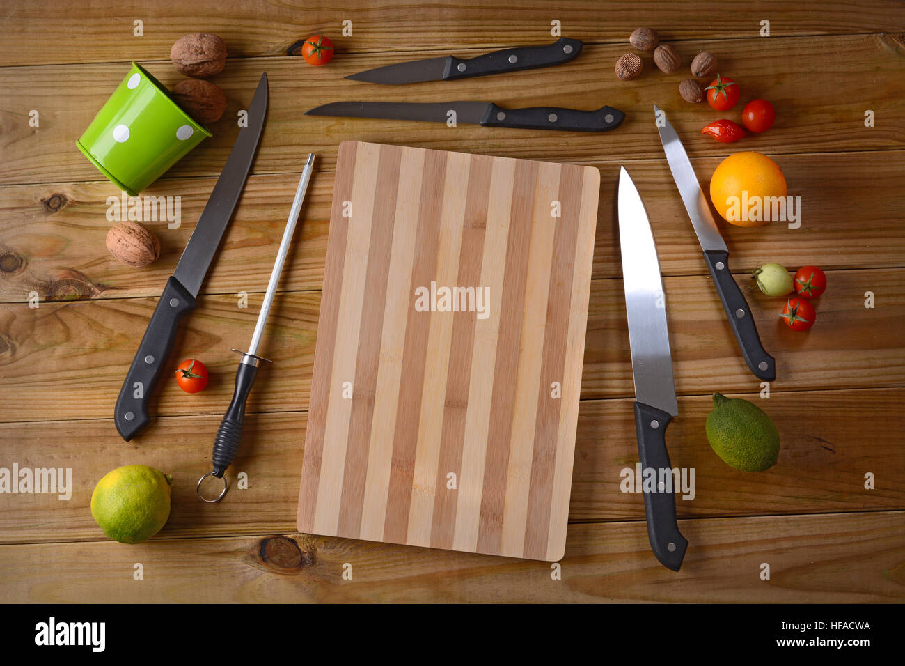 kitchen knives with ingredients on the table Stock Photo - Alamy