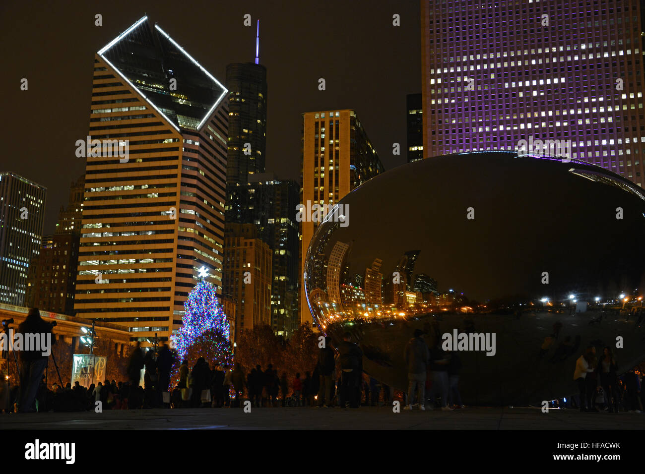 Cloud Gate, also known as "The Bean" reflects the night skyline ...