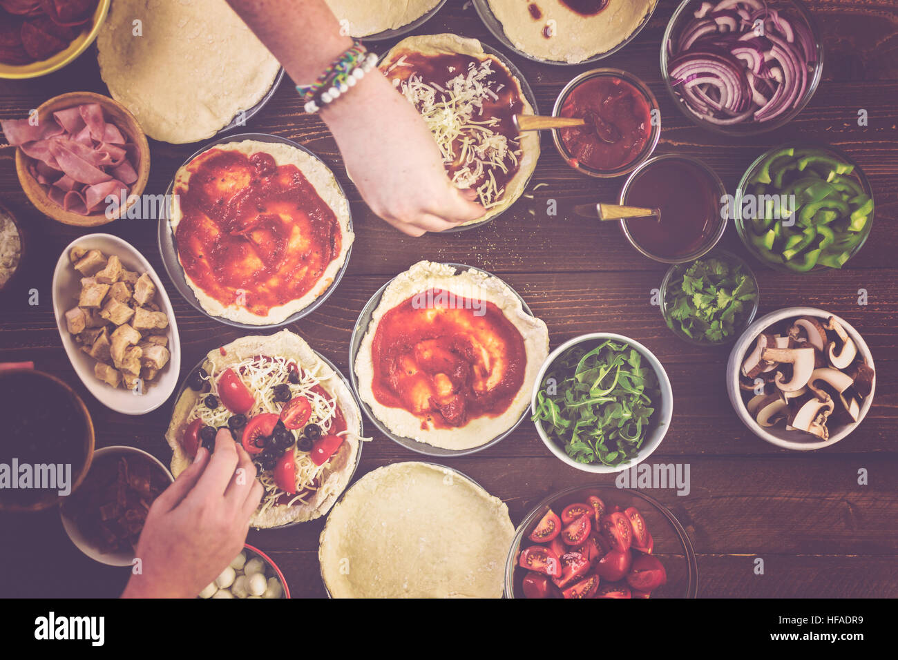 Preparing individual pizzas from pizza bar Stock Photo - Alamy