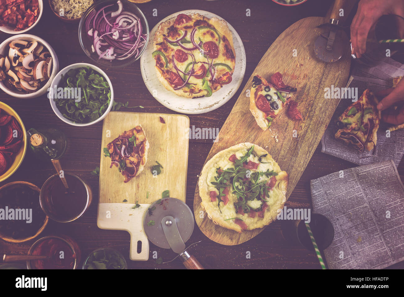 Eating individual pizzas from pizza bar Stock Photo - Alamy