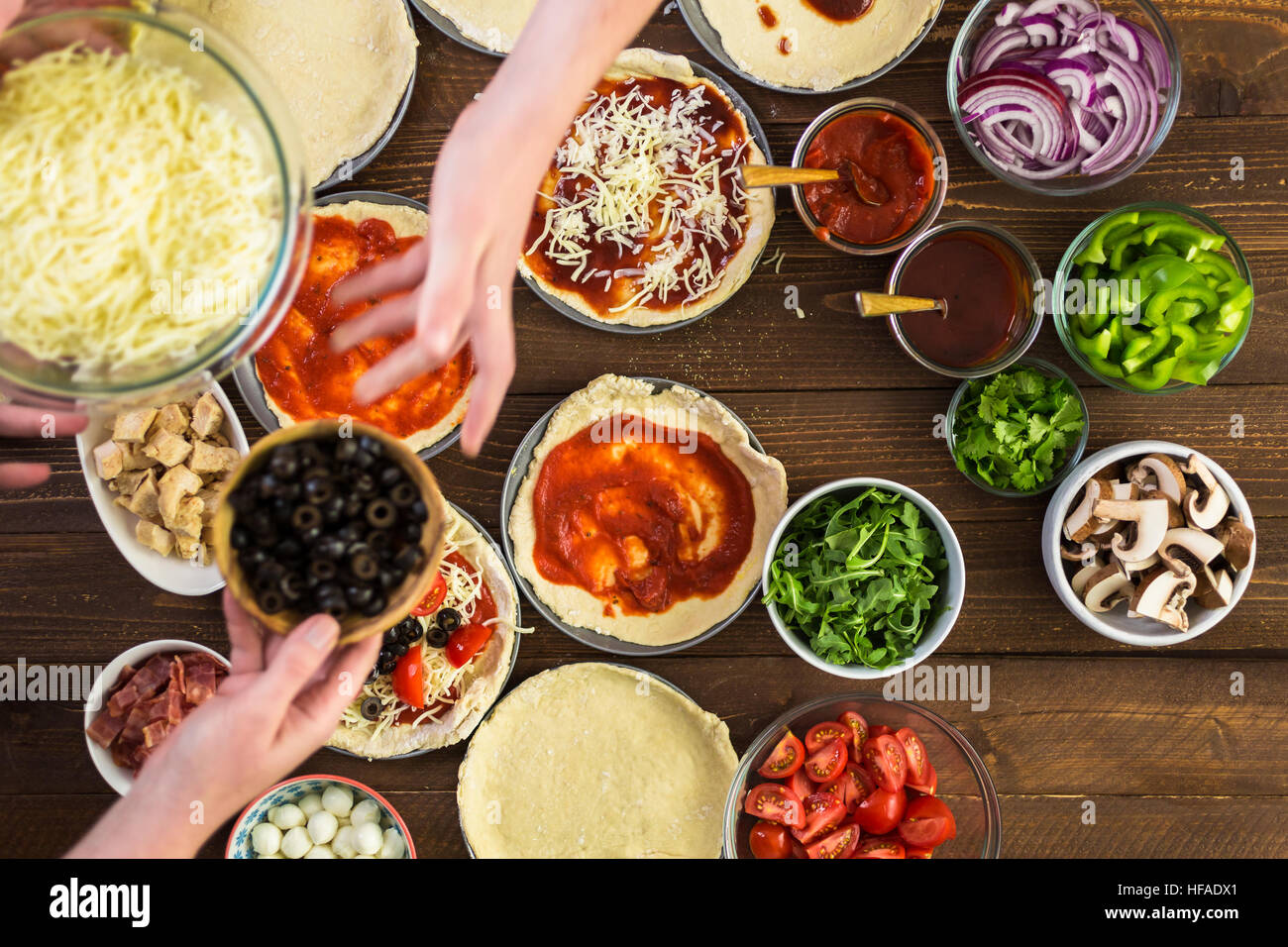Preparing individual pizzas from pizza bar Stock Photo - Alamy