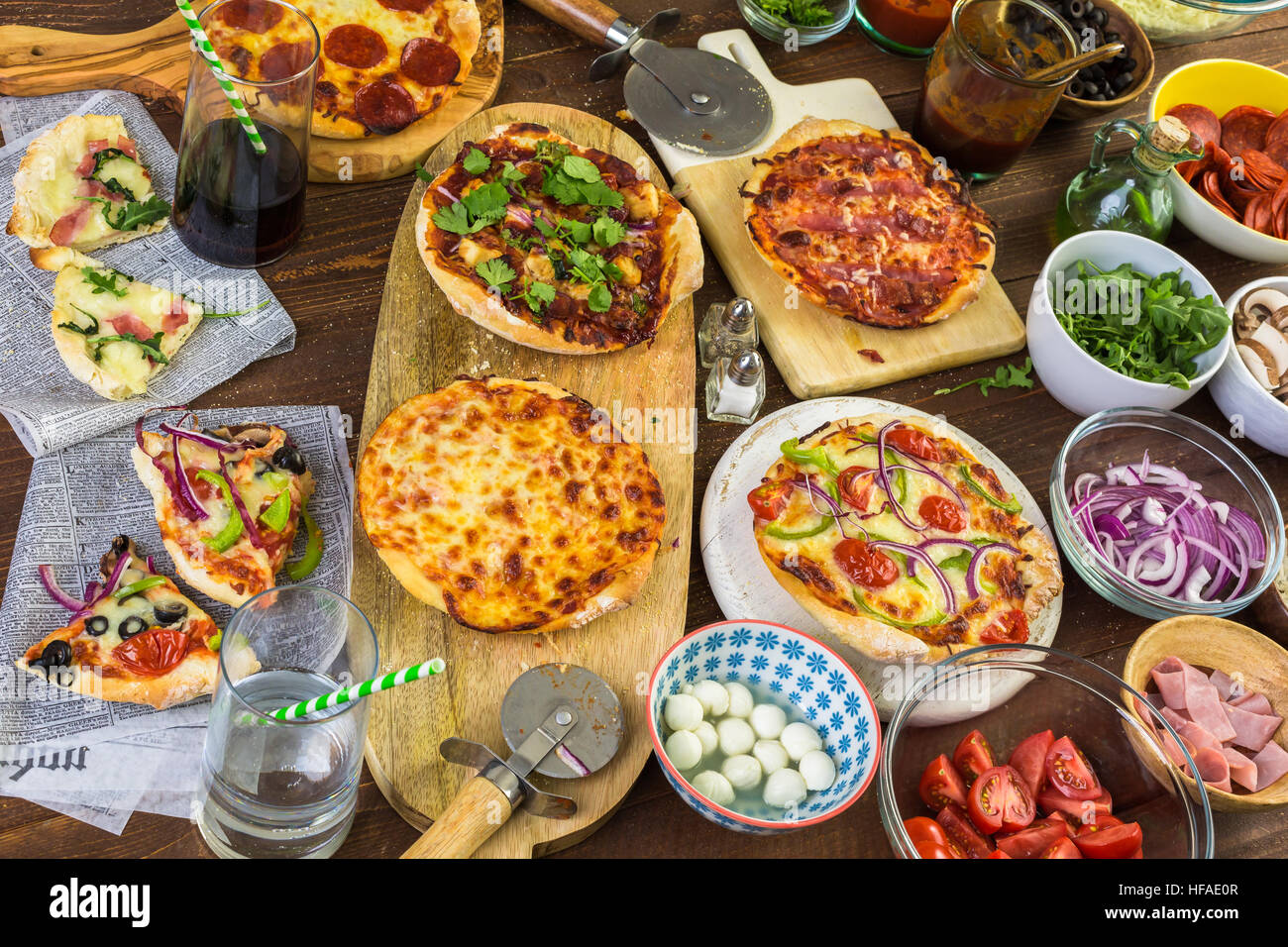 Eating individual pizzas from pizza bar Stock Photo - Alamy