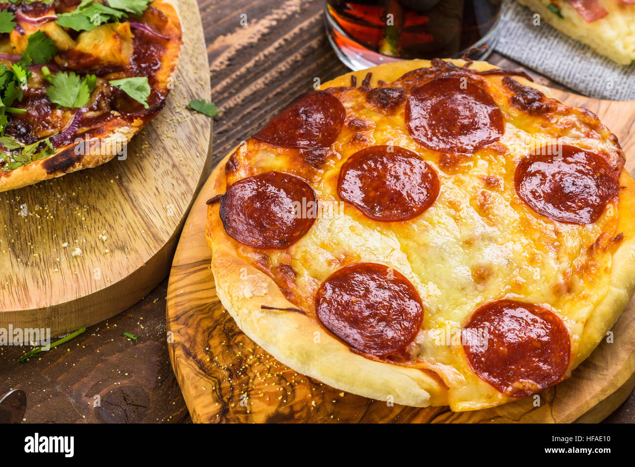 Eating individual pizzas from pizza bar Stock Photo - Alamy