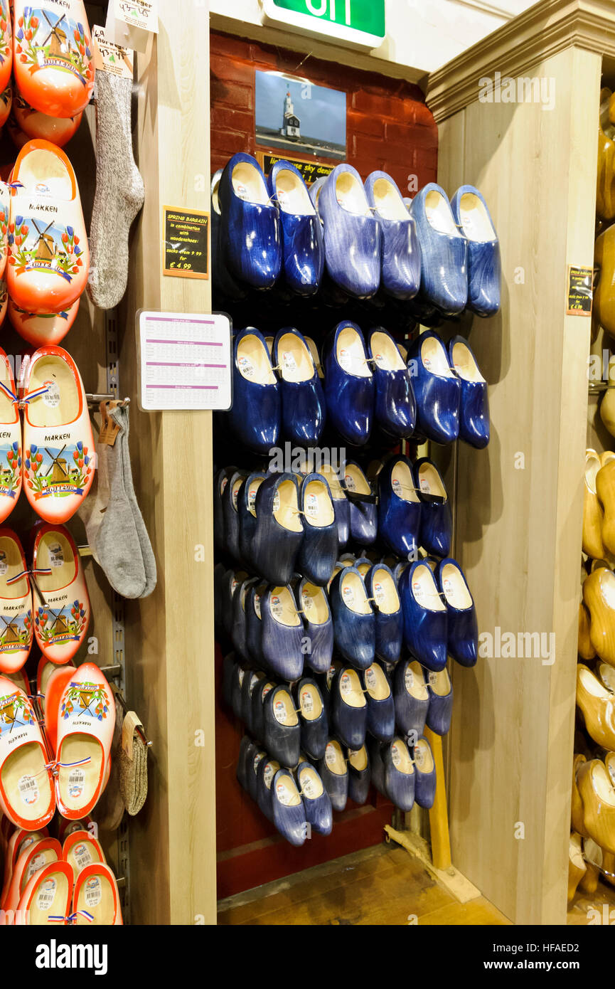 Wooden clogs on shoe racks on display in a shop in Amsterdam, Holland ...