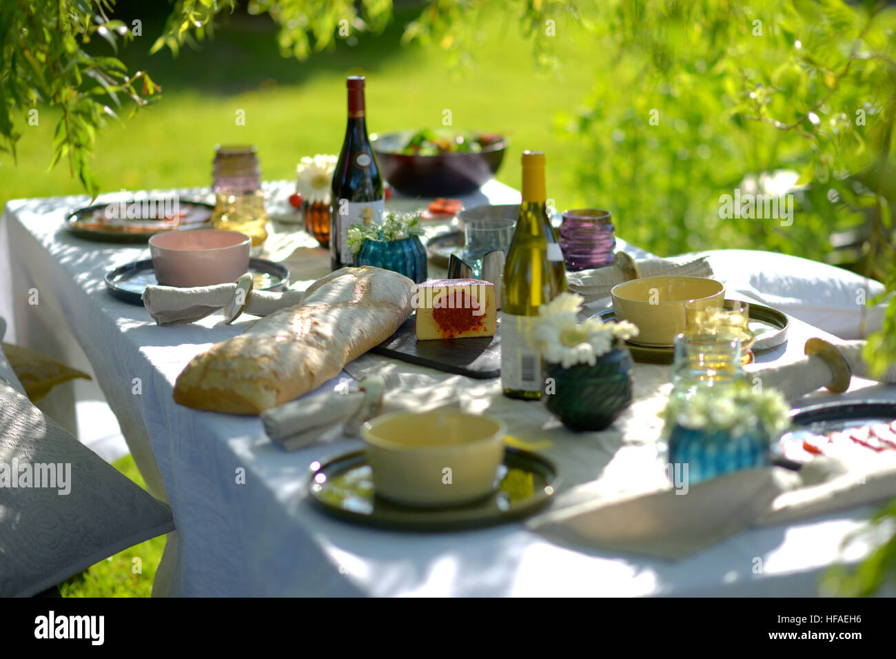 Alfresco dining, table set for an evening meal outside Stock Photo - Alamy