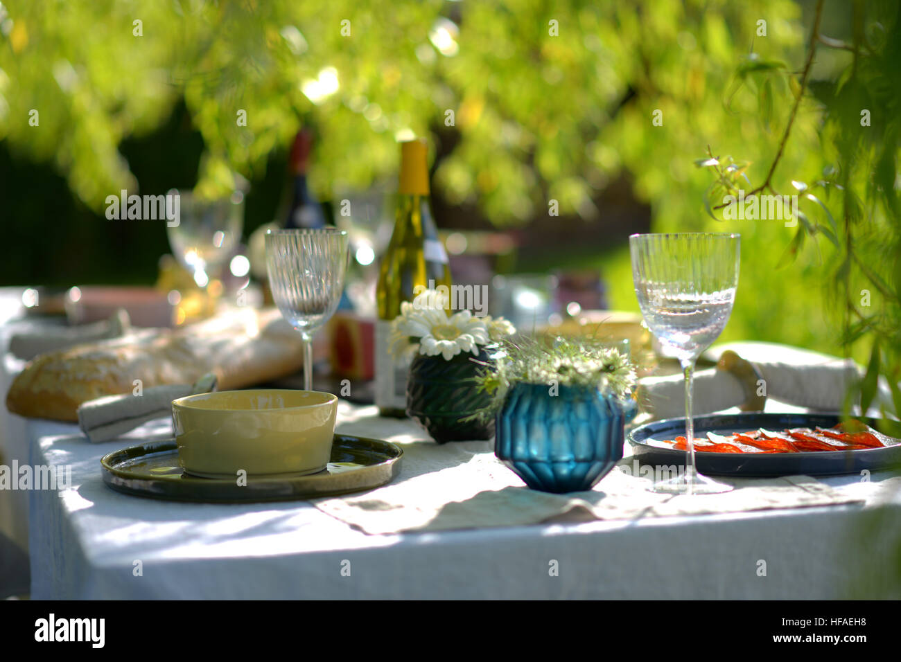 Alfresco dining, table set for an evening meal outside Stock Photo - Alamy