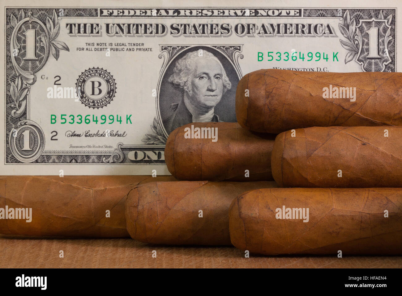 Luxury Cuban cigars with US dollar banknote on the wooden table Stock ...