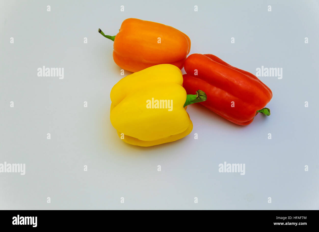 colorful mini peppers on white background Stock Photo - Alamy