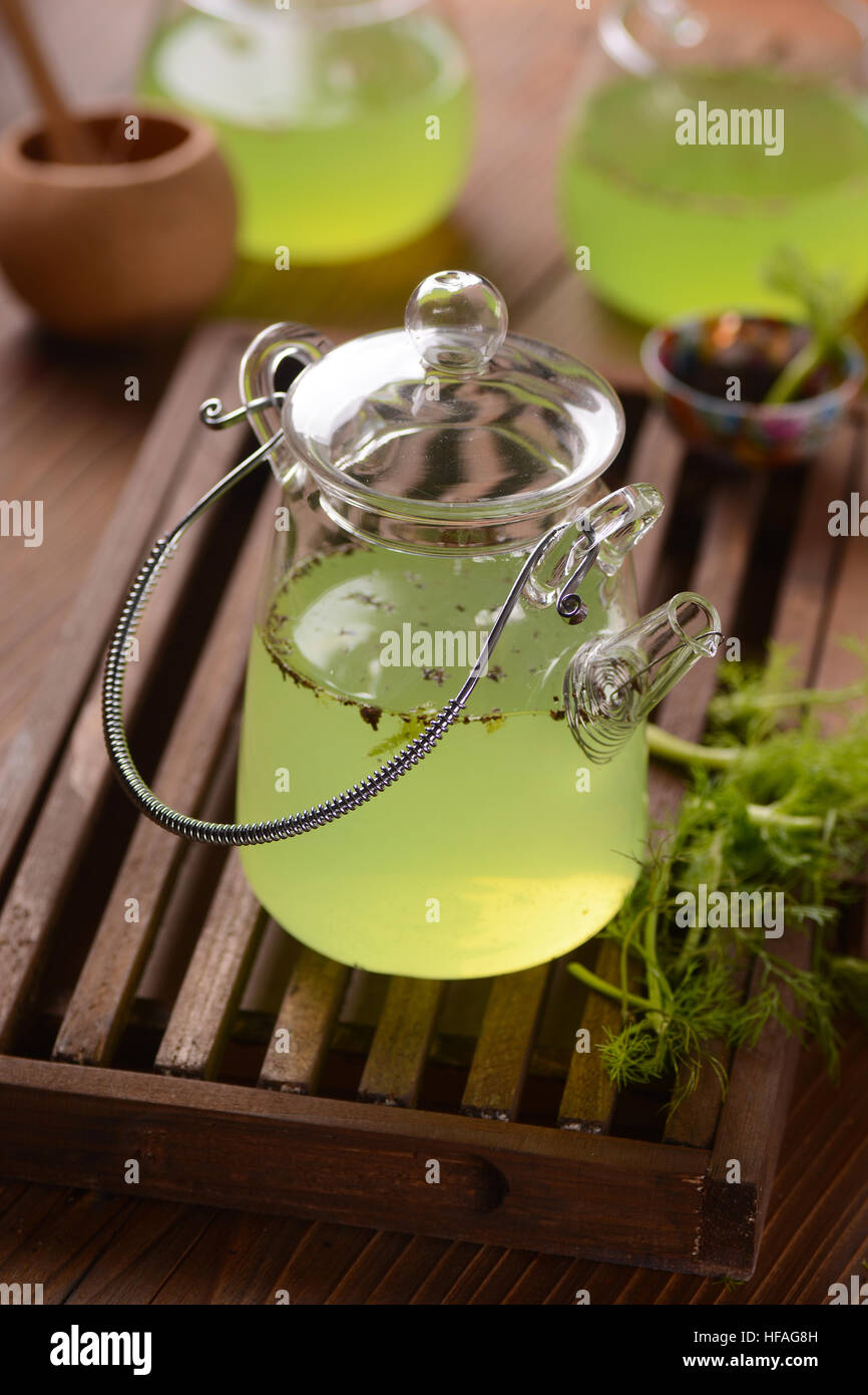 Green tea in glass teapot Stock Photo - Alamy