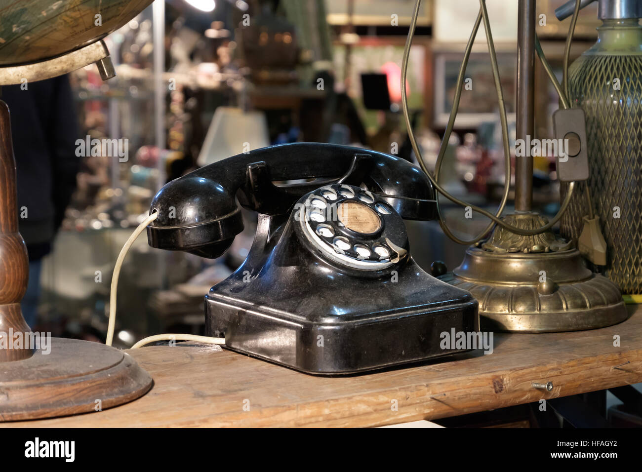 Vintage phone on old wooden table Stock Photo - Alamy