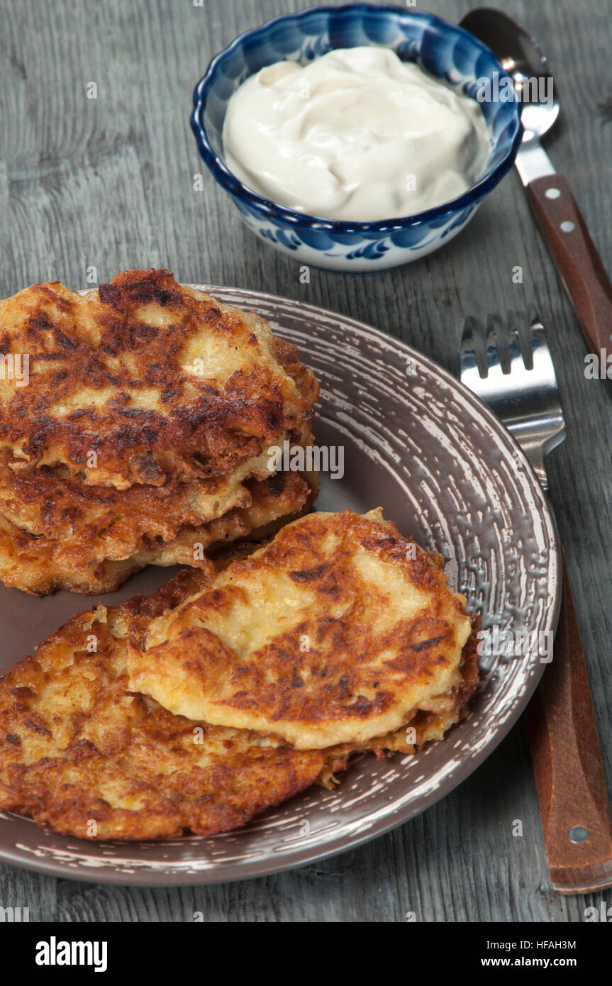 Marrow zuccini flapjack on timber board, close up Stock Photo - Alamy
