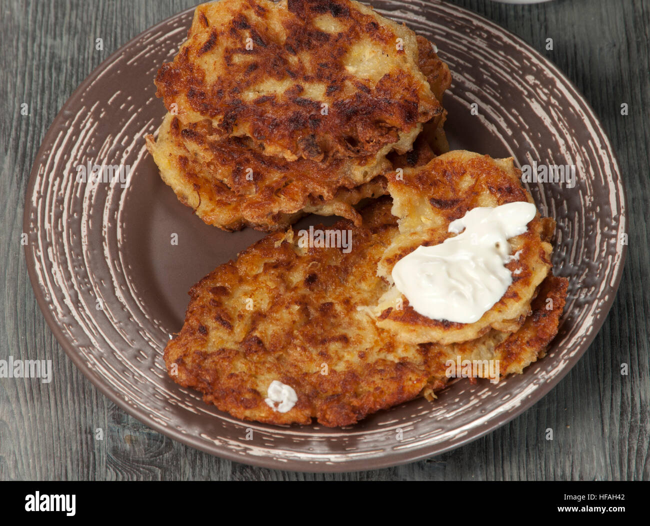 Marrow zuccini flapjack on timber board, close up Stock Photo - Alamy