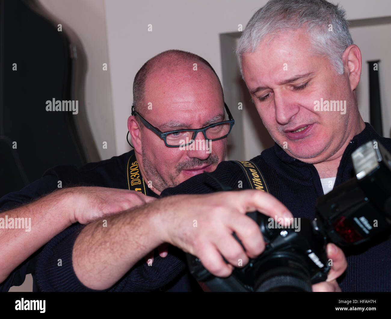 two photographers chimping Stock Photo - Alamy