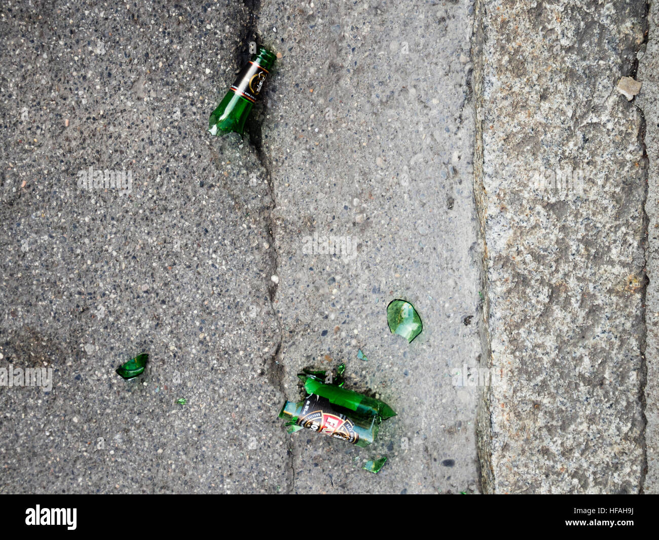 a broken beer bottle on the street Stock Photo - Alamy