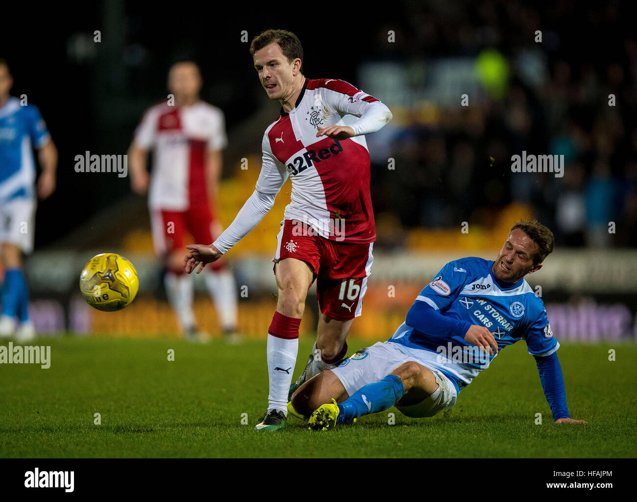 St Johnstone's Chris Millar and Rangers Andy Halliday compete for the ...