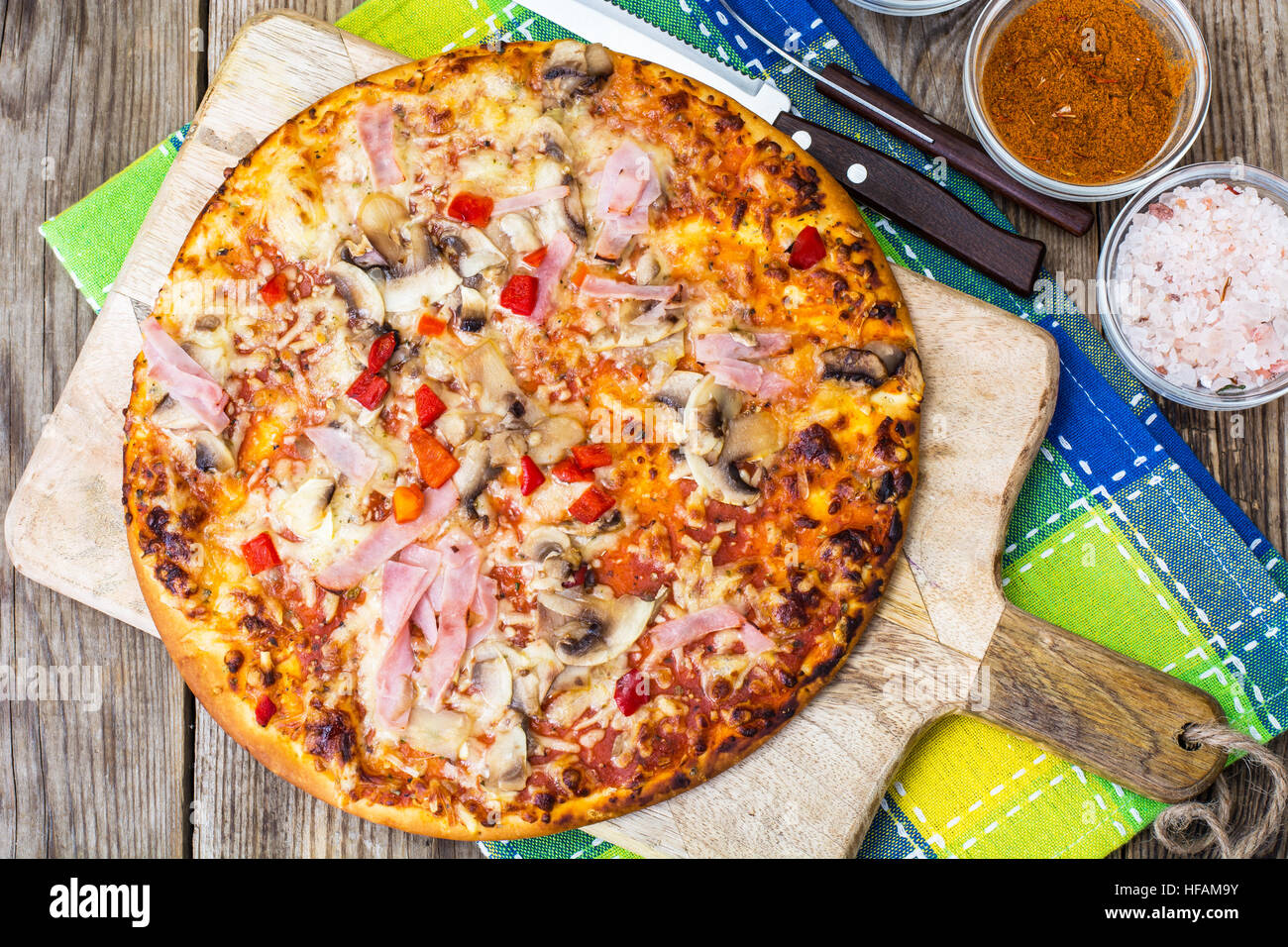 Homemade pizza with ham and mushrooms Stock Photo - Alamy
