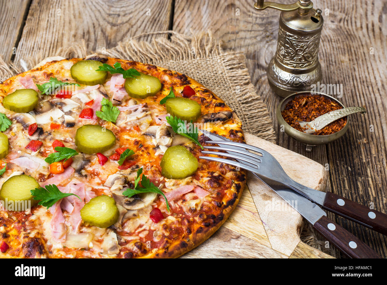 Homemade pizza with ham and mushrooms Stock Photo - Alamy