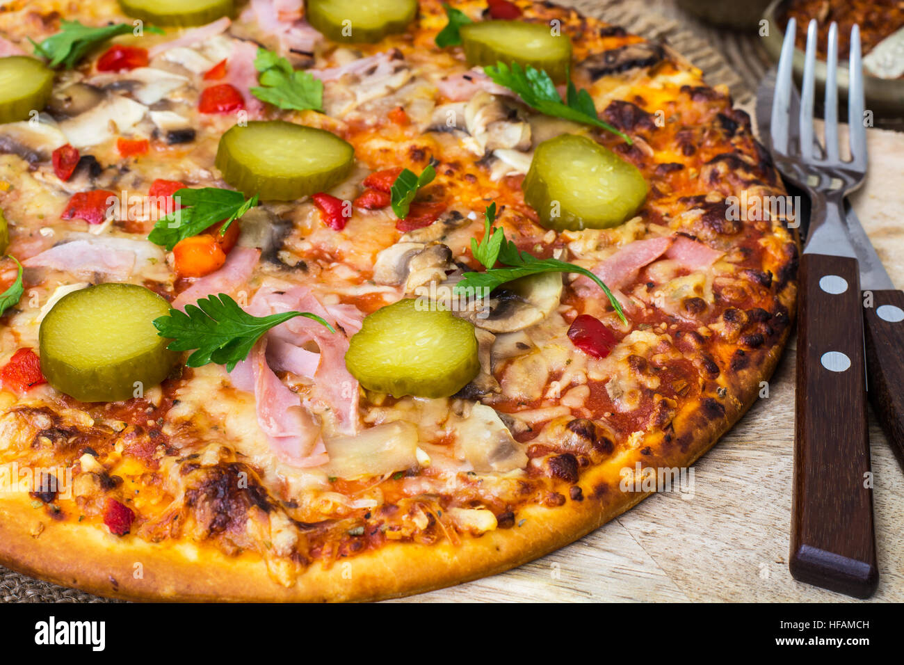 Homemade pizza with ham and mushrooms Stock Photo - Alamy