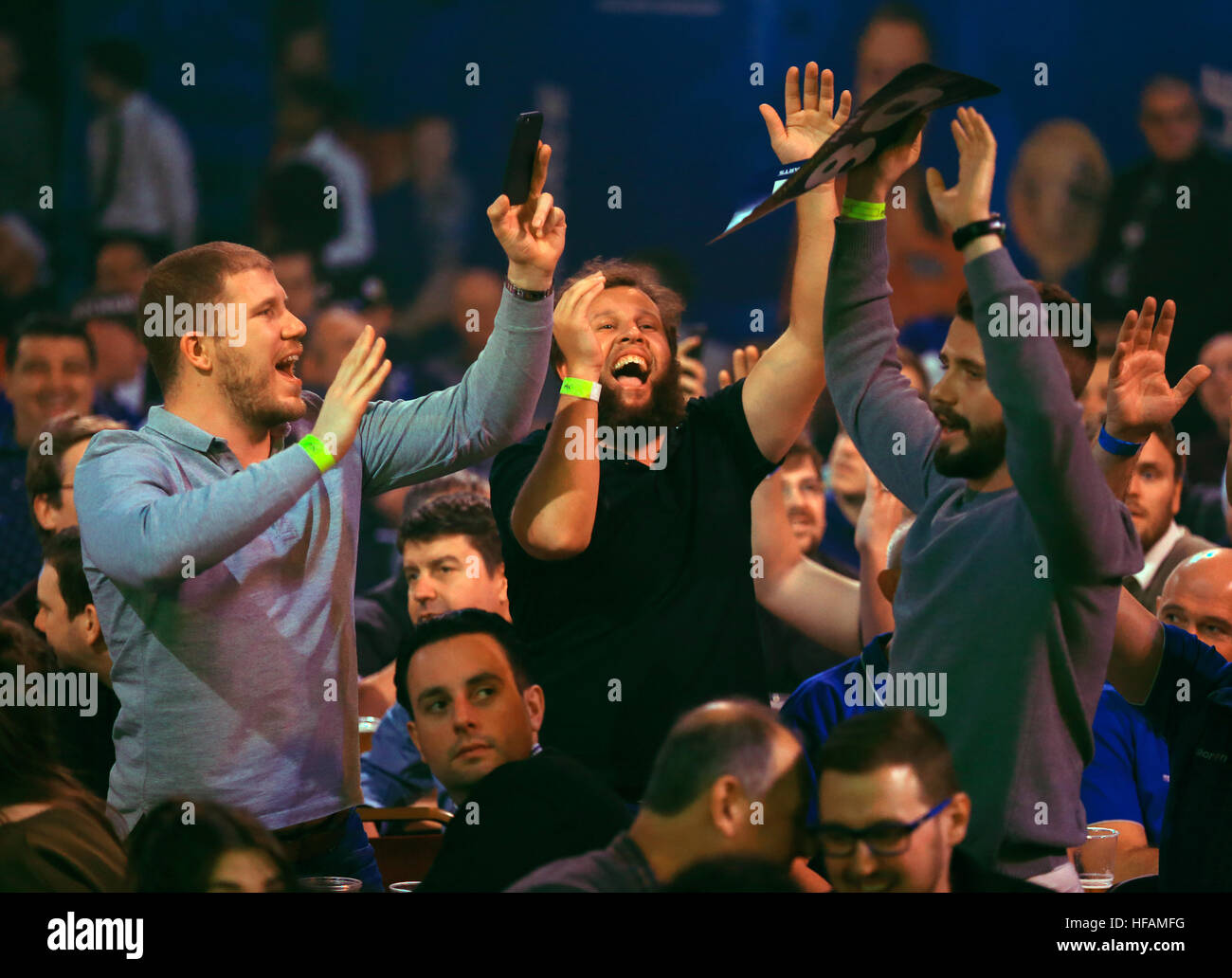 Golfer Andrew 'Beef' Johnston (centre) enjoying the action during day ...