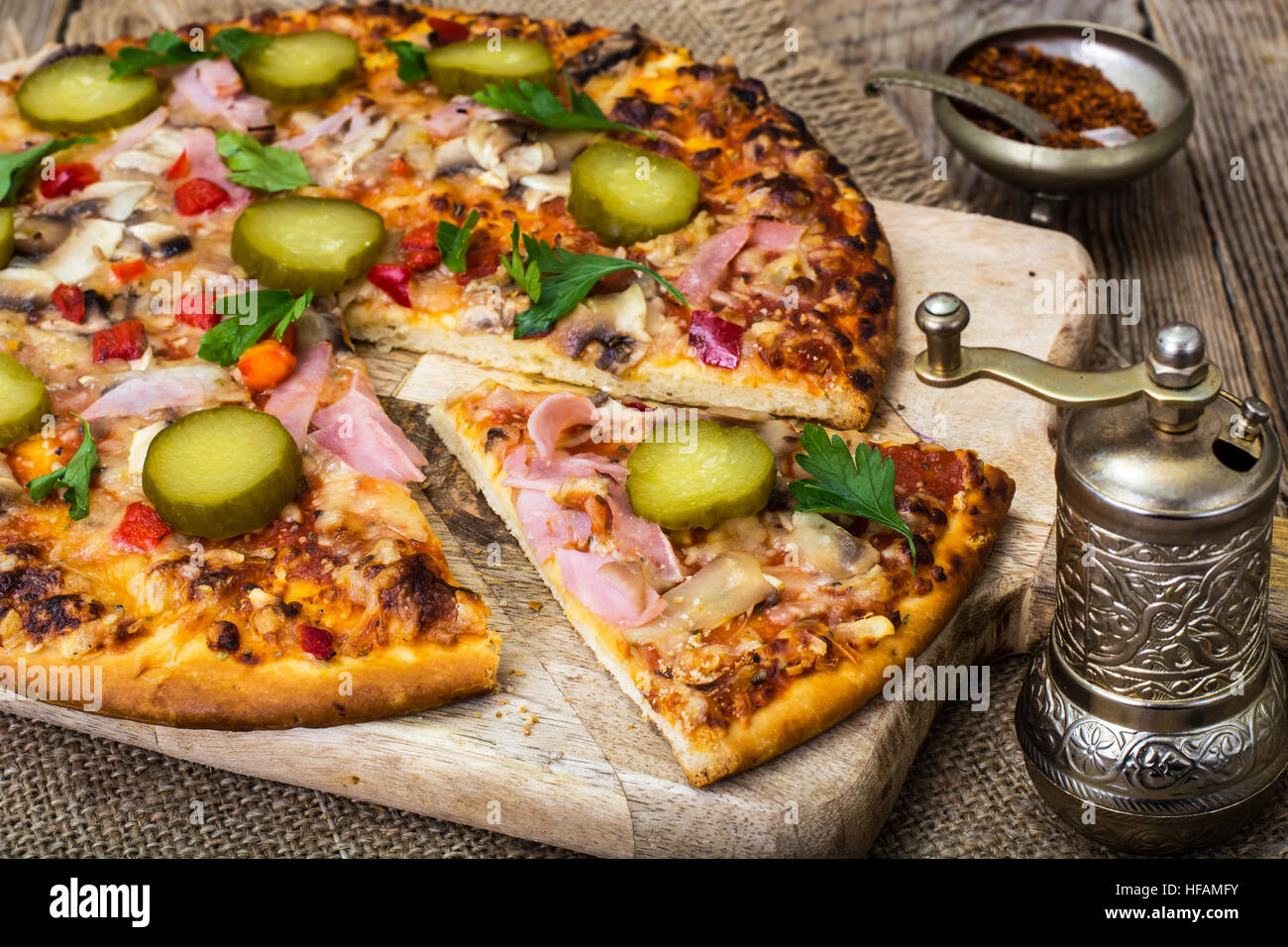 Homemade pizza with ham and mushrooms Stock Photo - Alamy