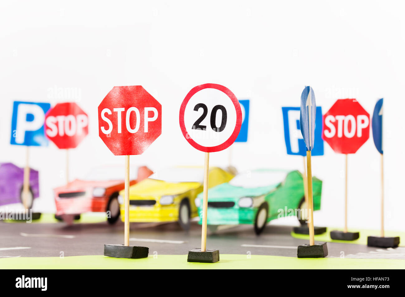 Play set of toy speed-limit and stop road signs Stock Photo - Alamy