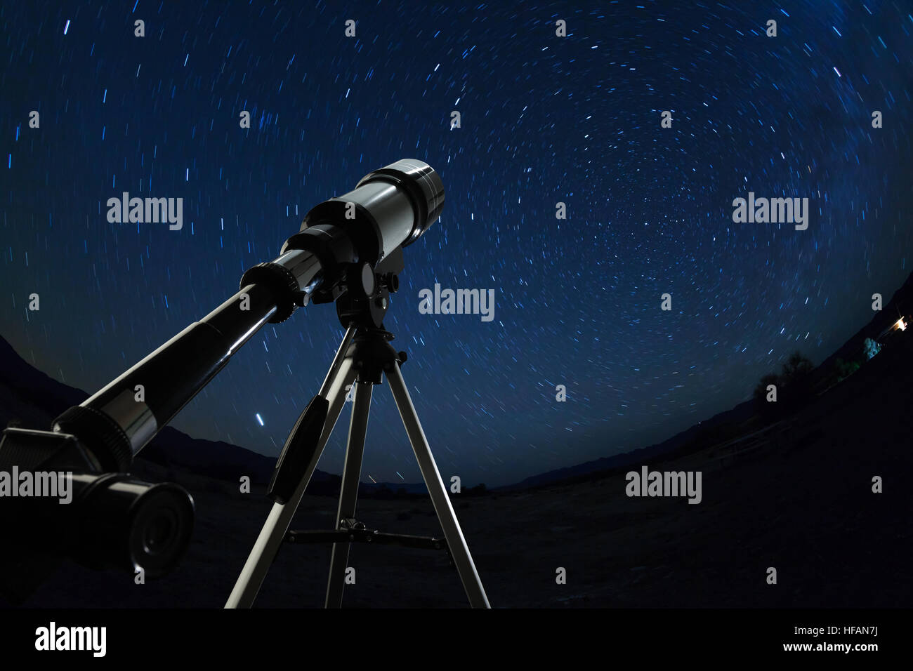 Telescope pointed to the clear night sky and stars Stock Photo - Alamy