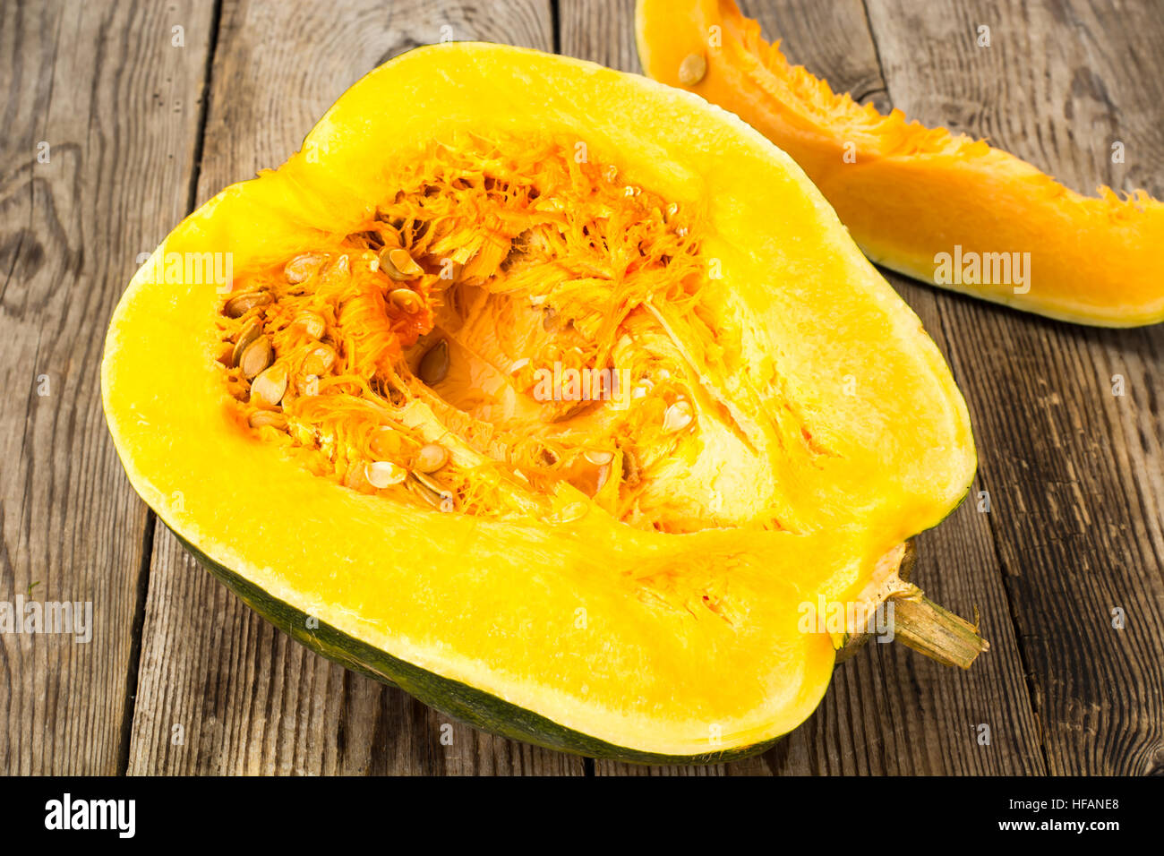 Cut the pumpkin in half and slice Stock Photo - Alamy