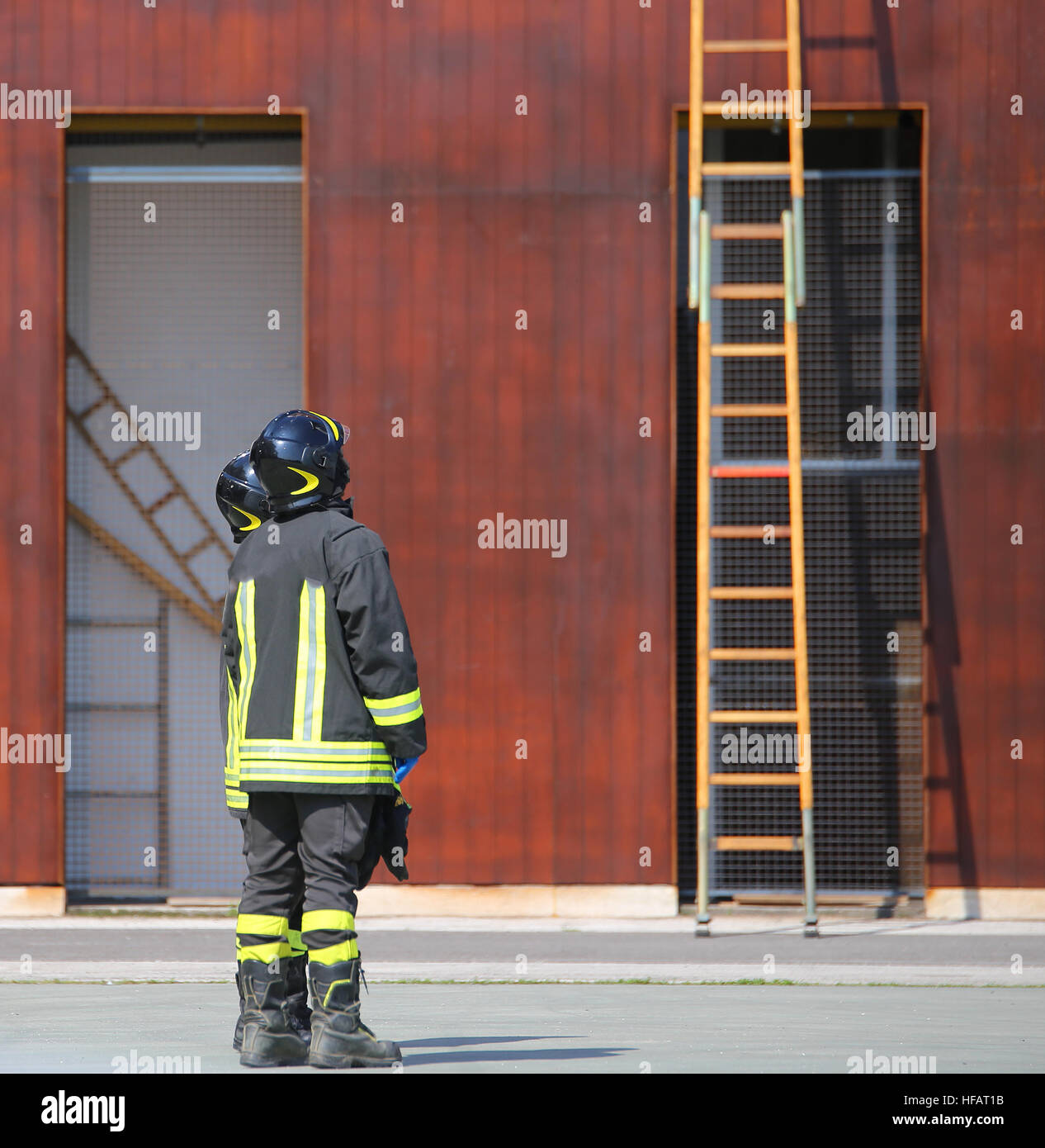 two firefighters during a training exercise in the firehouse Stock ...