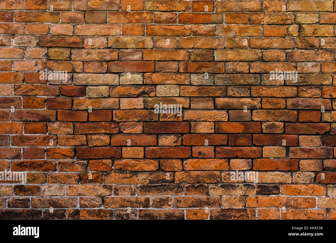 An ancient reddish brick wall closeup Stock Photo - Alamy