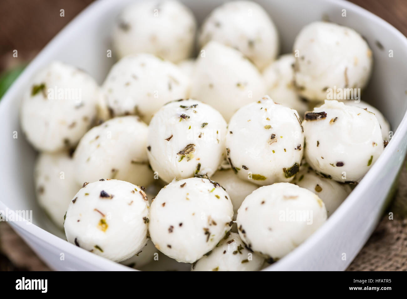 Portion of small Mozzarella Cheese (marinated with herbs; selective ...