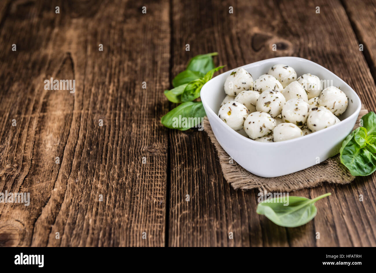 Portion of small Mozzarella Cheese (marinated with herbs; selective ...