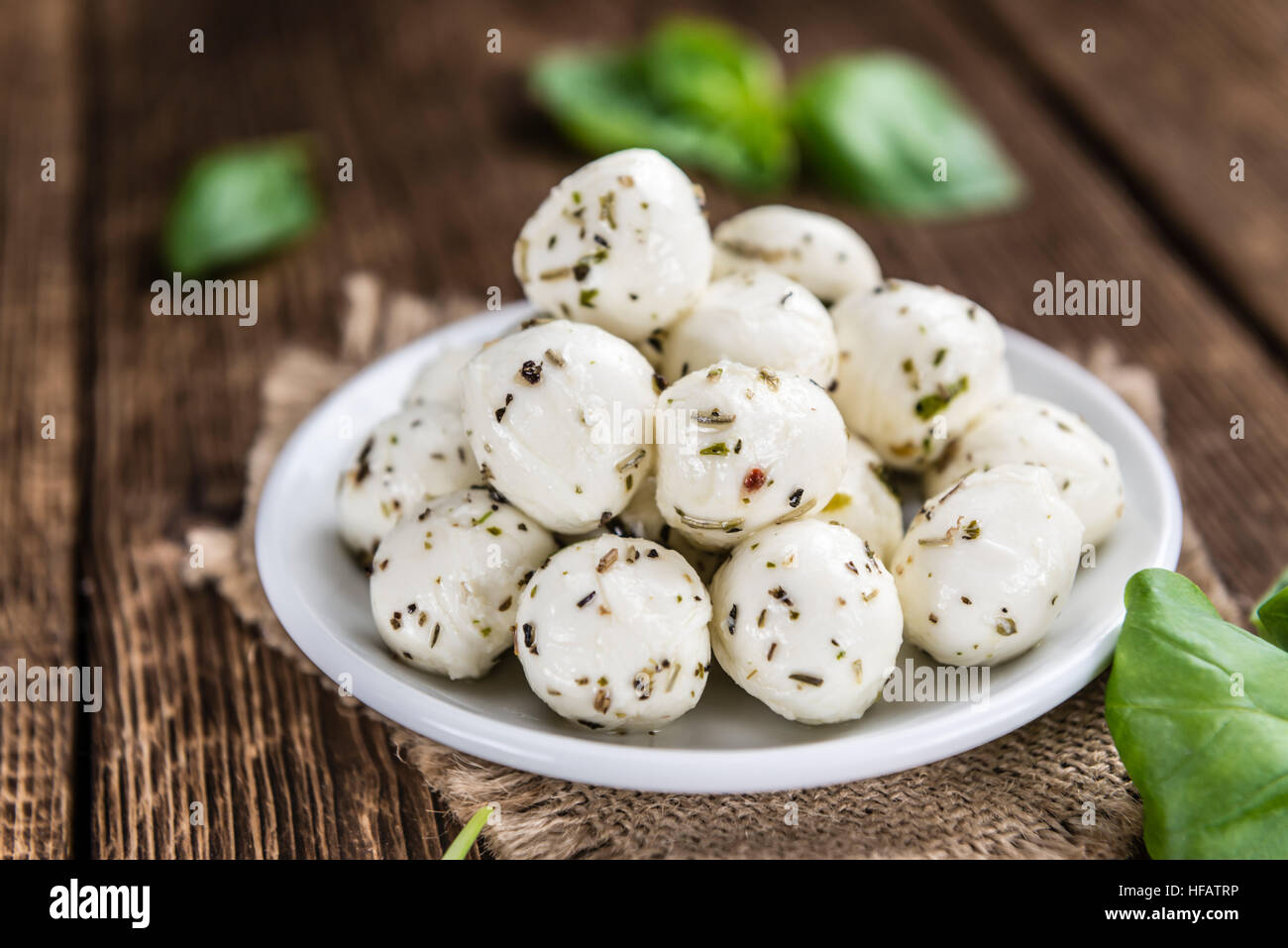 Portion of small Mozzarella Cheese (marinated with herbs; selective ...