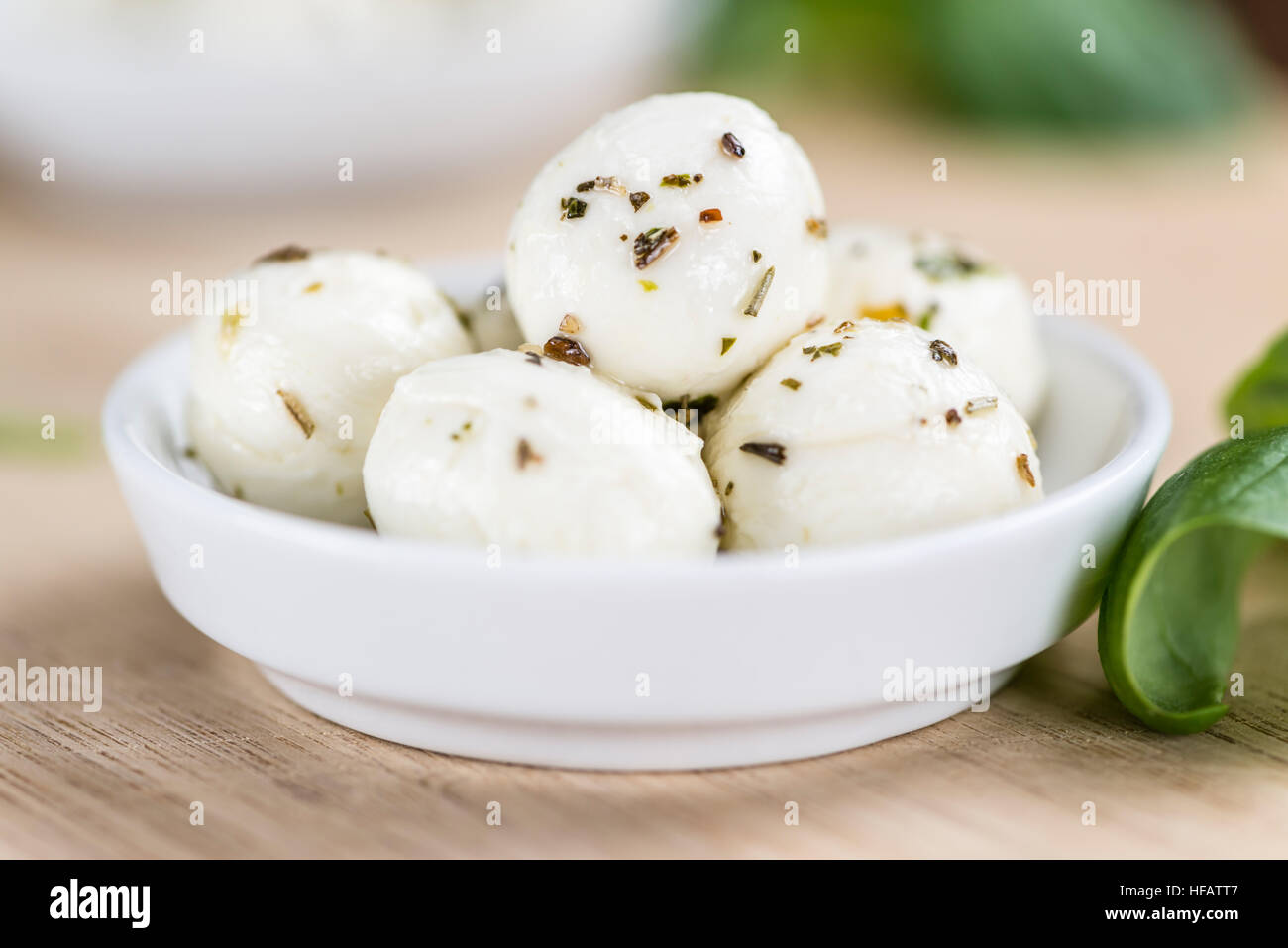 Portion of small Mozzarella Cheese (marinated with herbs; selective ...