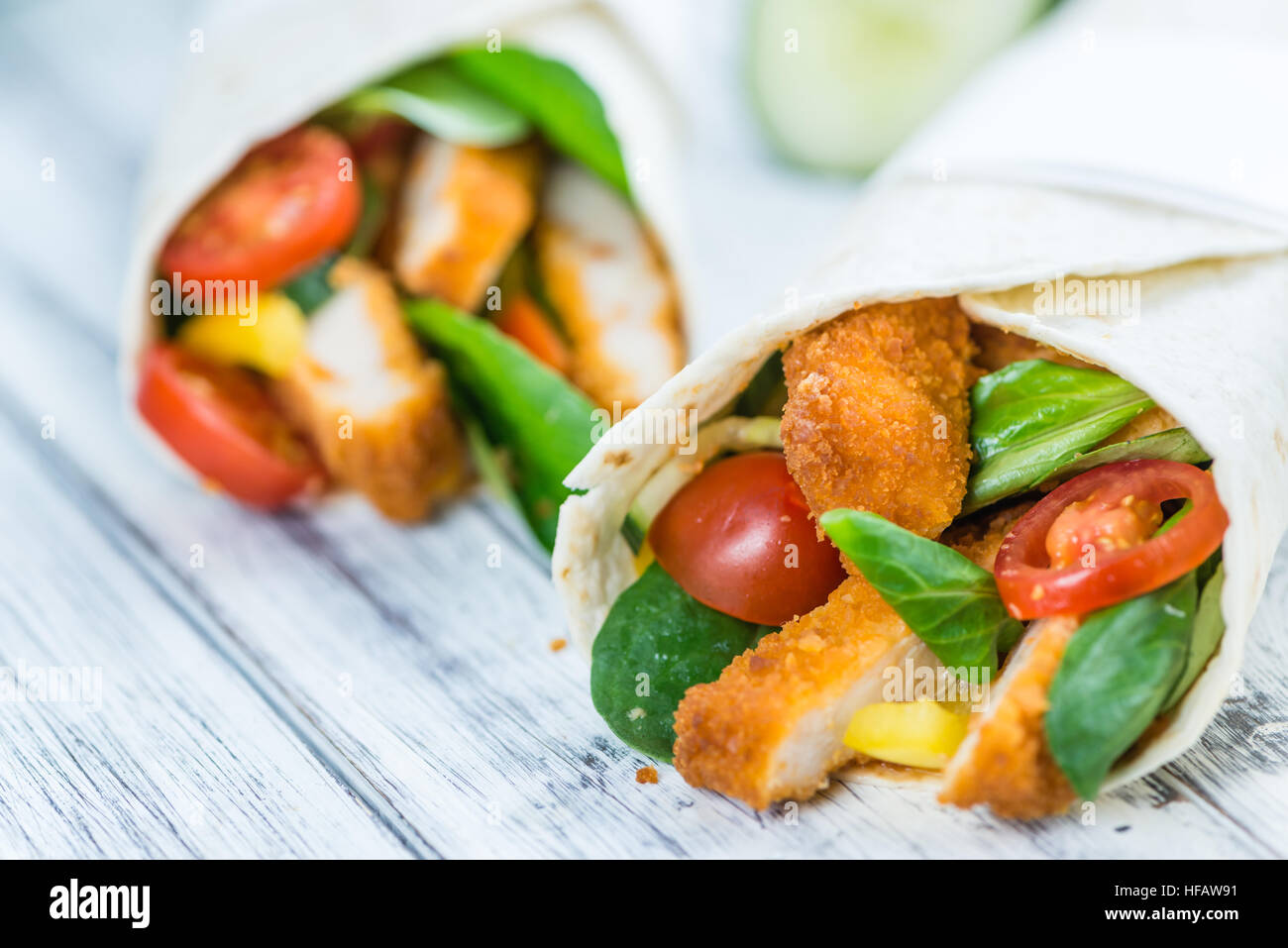Fresh made Chicken Wraps on an vintage background (selective focus ...